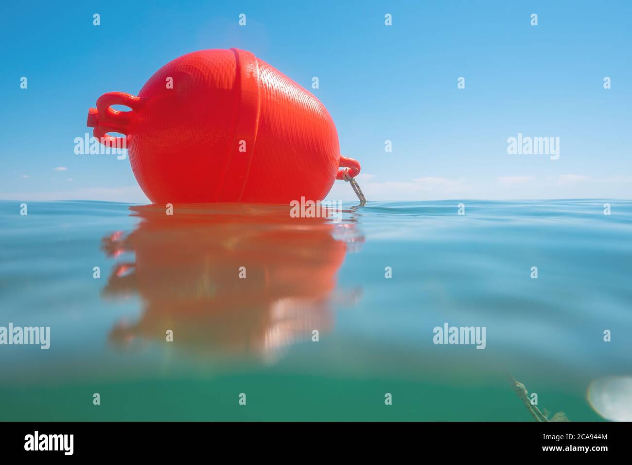 Buoy float on the sea water and underwater view Stock Photo - Alamy