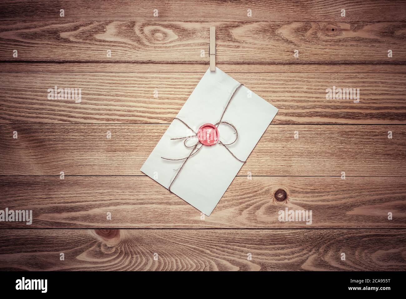 Mail envelope on rope Stock Photo - Alamy