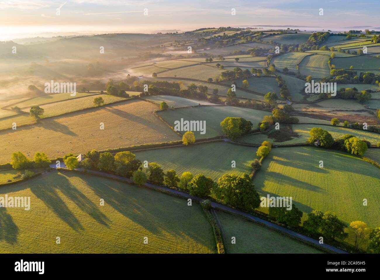 Beautiful morning sunlight over rolling countryside in spring, South ...