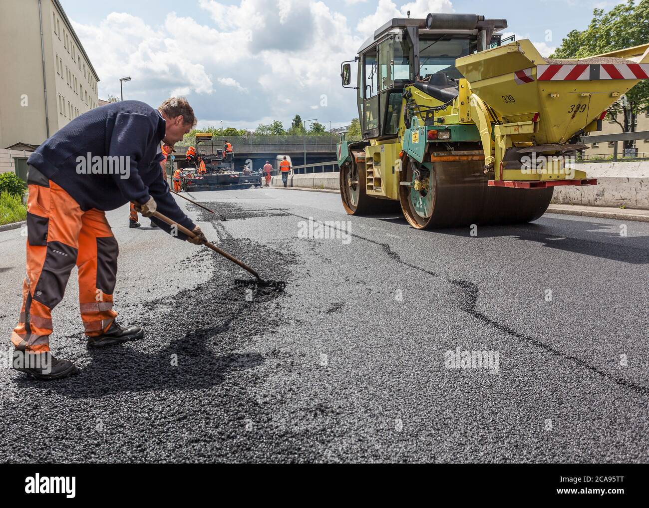 Roadworks, application of new asphalt on german highway Stock Photo - Alamy