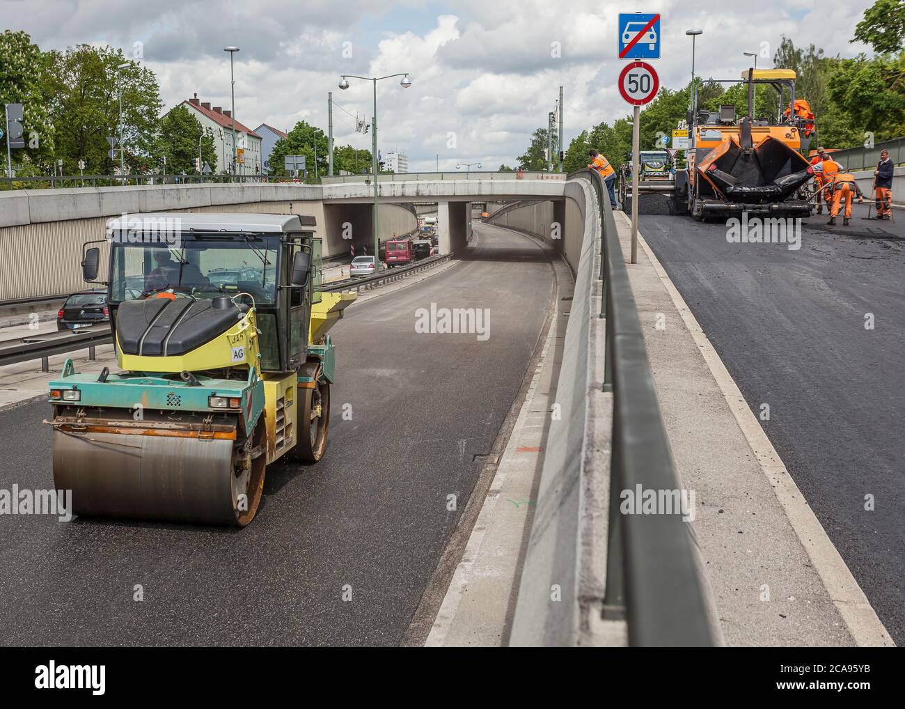 Roadworks, application of new asphalt on german highway Stock Photo - Alamy
