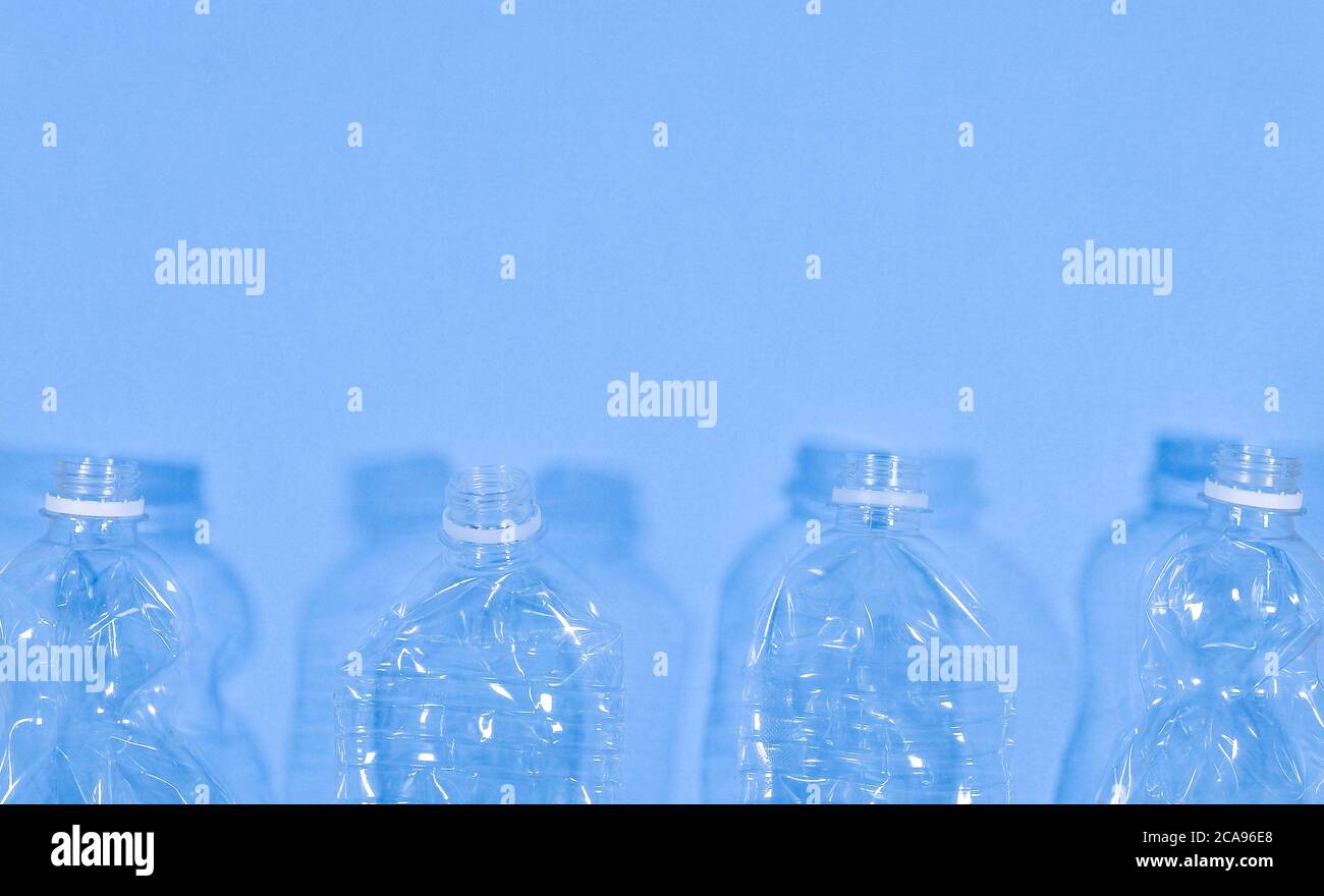 Plastic bottles isolated on blue background. Seamless pattern. Recycle ...