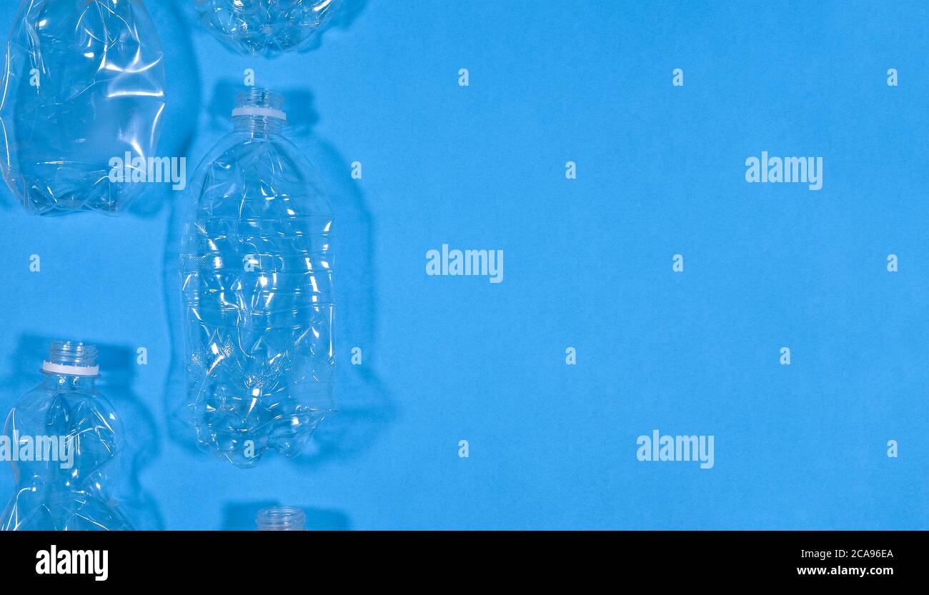 Plastic bottles isolated on blue background. Seamless pattern. Recycle ...