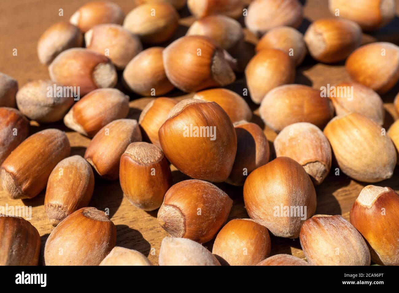 Natural organic hazelnuts on the wood table background Stock Photo - Alamy