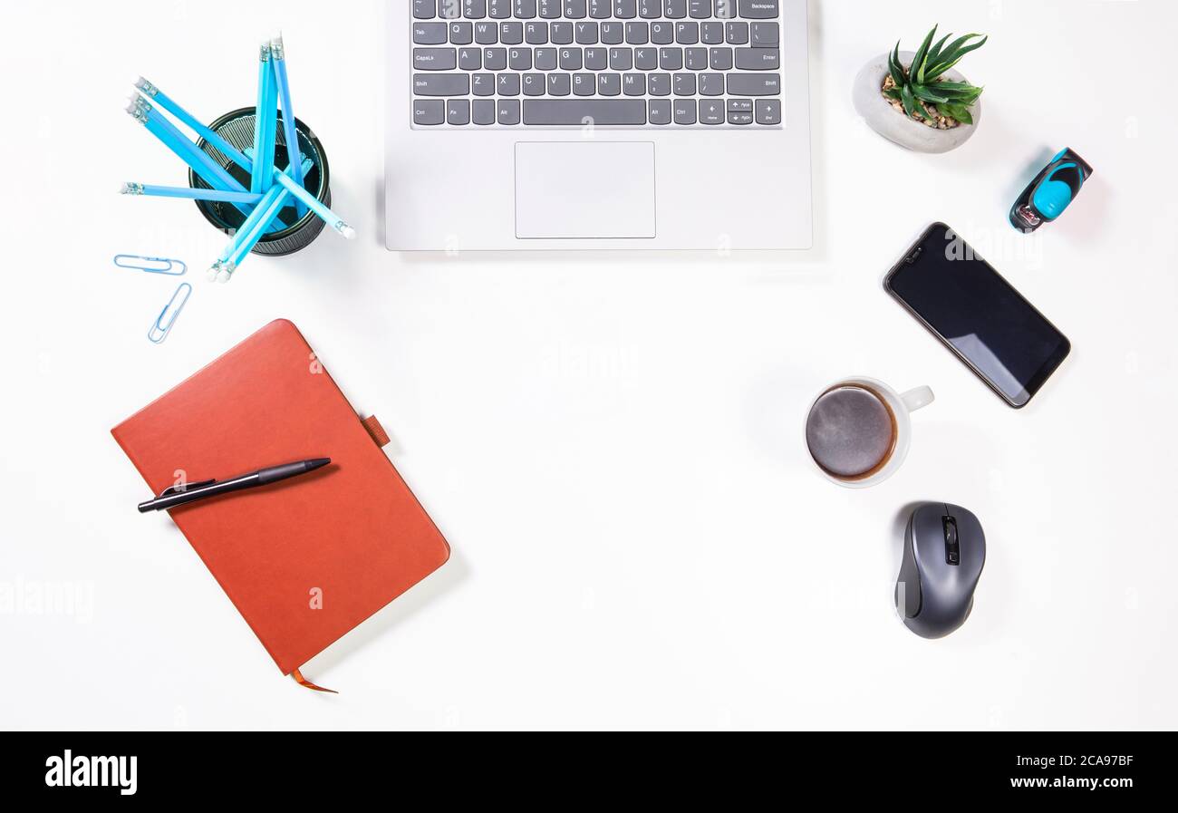 Office workplace table top view with coffe, smartphone, laptop and ...