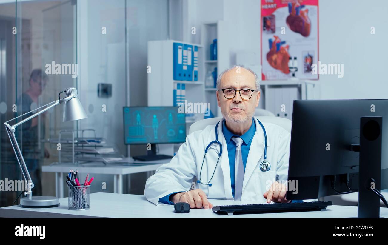 Doctor making an online consultation from private modern clinic where ...