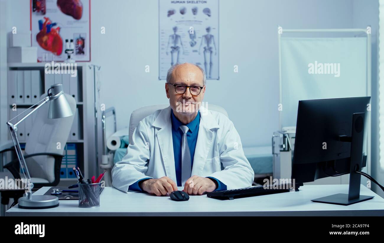 Handsome elderly doctor in uniform hi-res stock photography and images ...