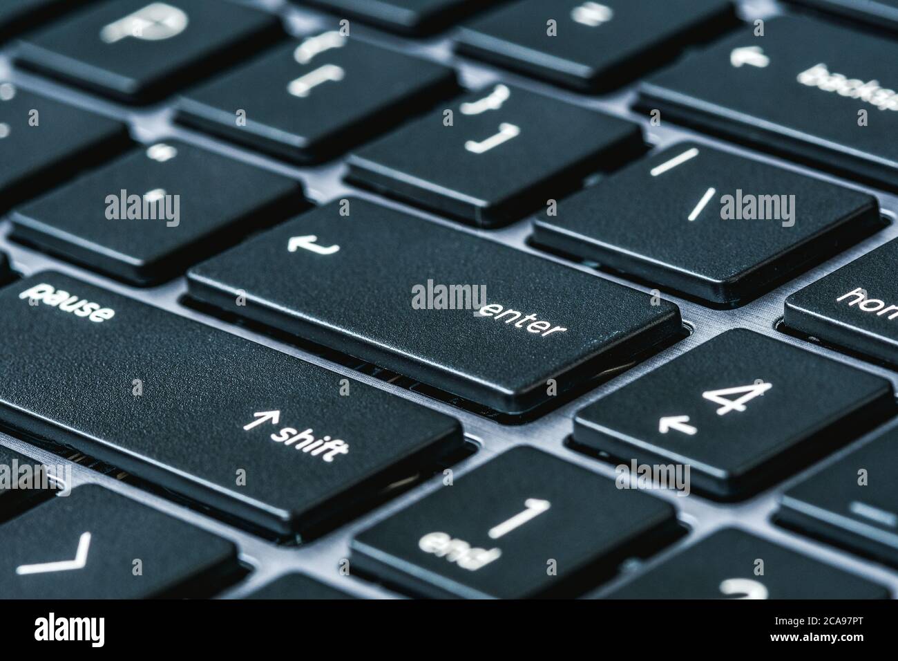 Close up view of computer keyboard with aluminium body. Selective focus ...