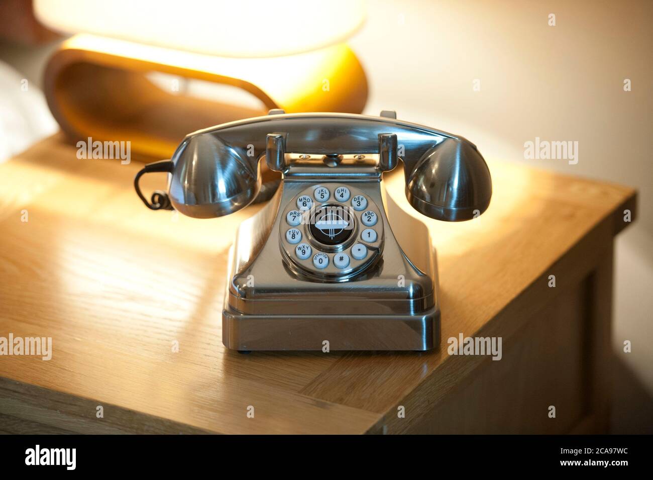 Vintage style telephone in silver Stock Photo - Alamy