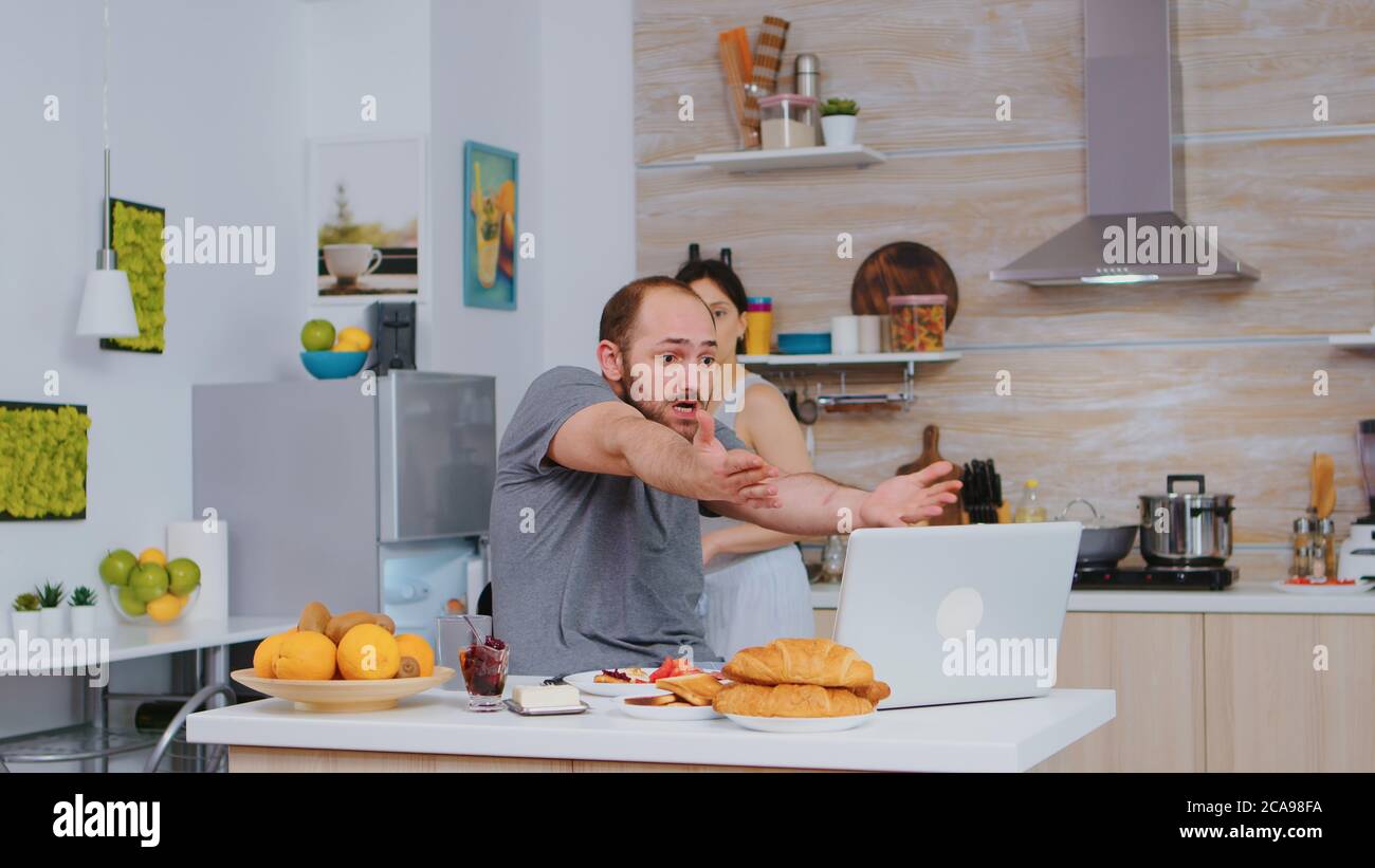Couple arguing during breakfast on hi-res stock photography and images ...