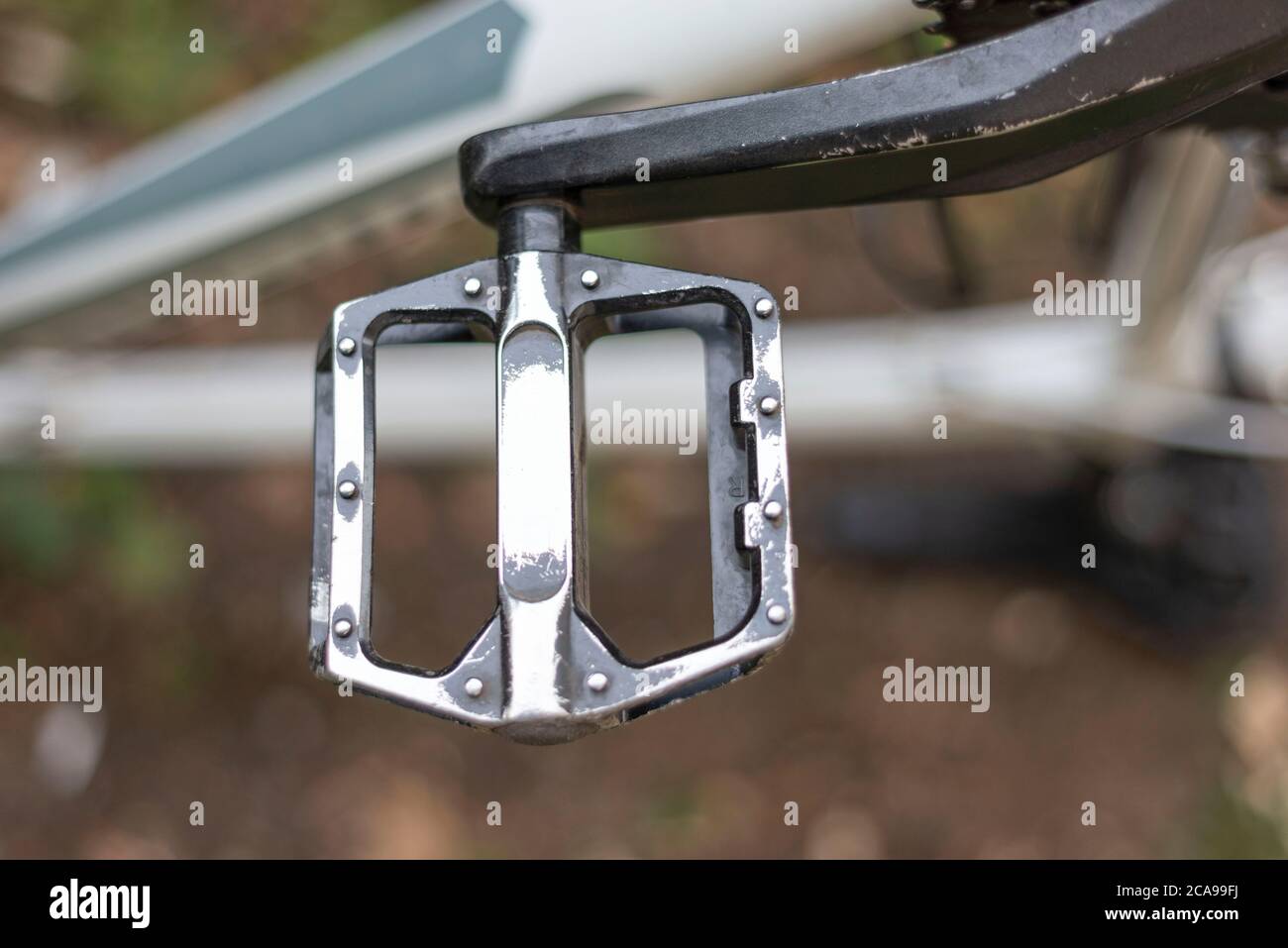 Bicycle pedal with a backdrop of artificial grass. close-up bicycle ...