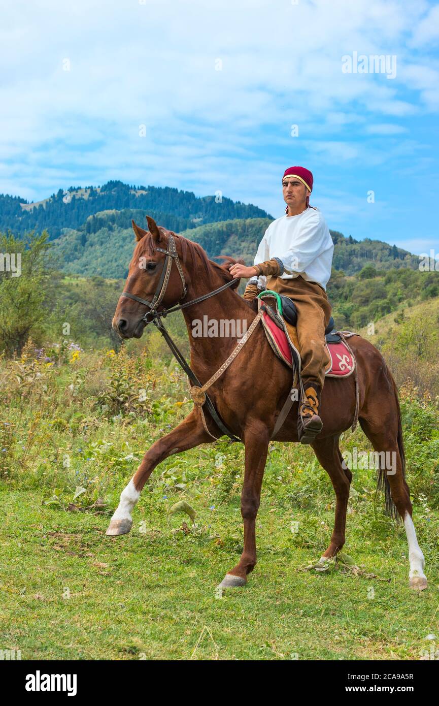 Man on a rearing horse, Kazakh ethnographical village Aul Gunny, Talgar ...