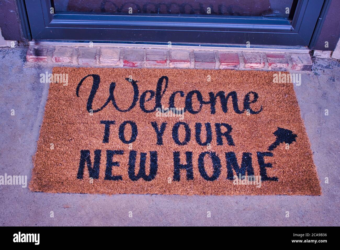 Real Estate agent welcome mat Stock Photo - Alamy