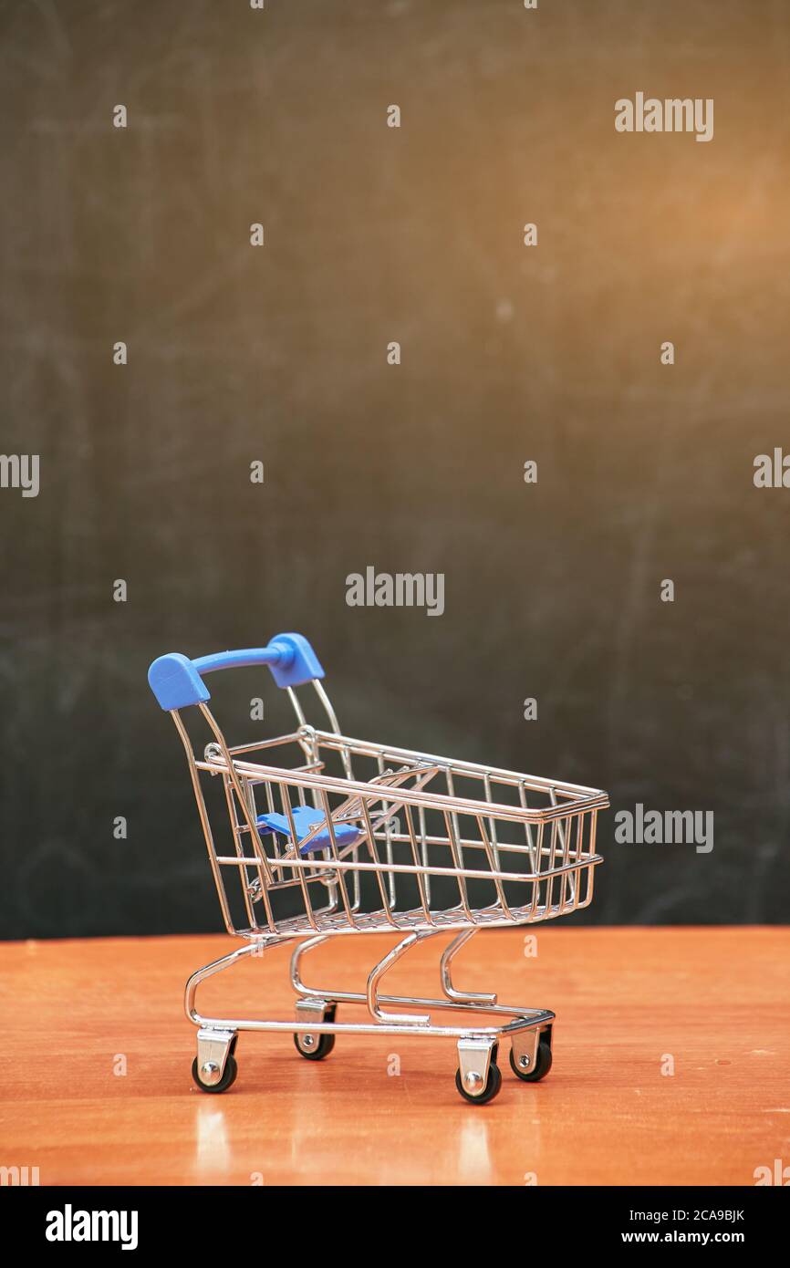 back to school concept, shopping cart on school board background ...