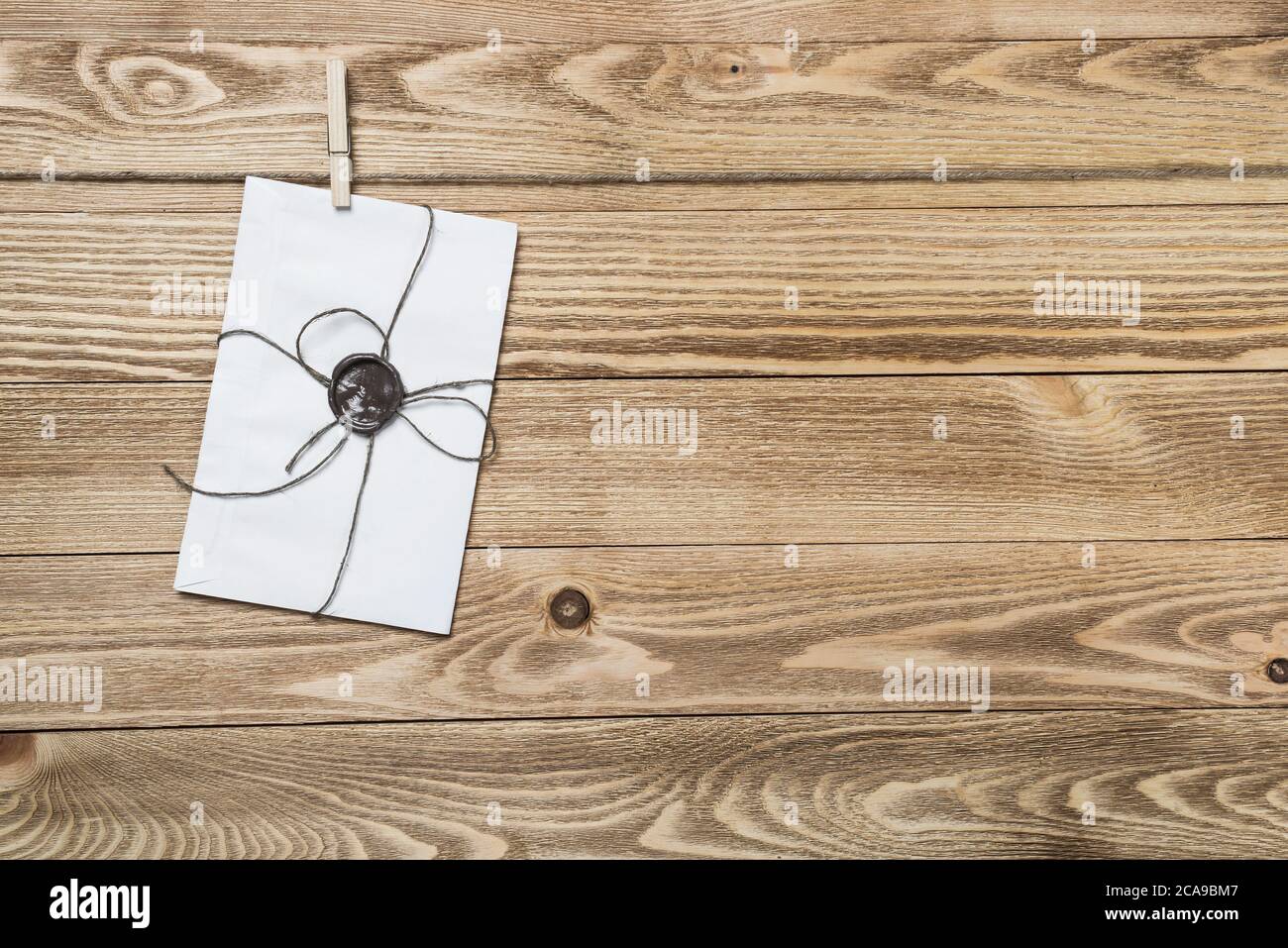 Mail envelope on rope Stock Photo - Alamy