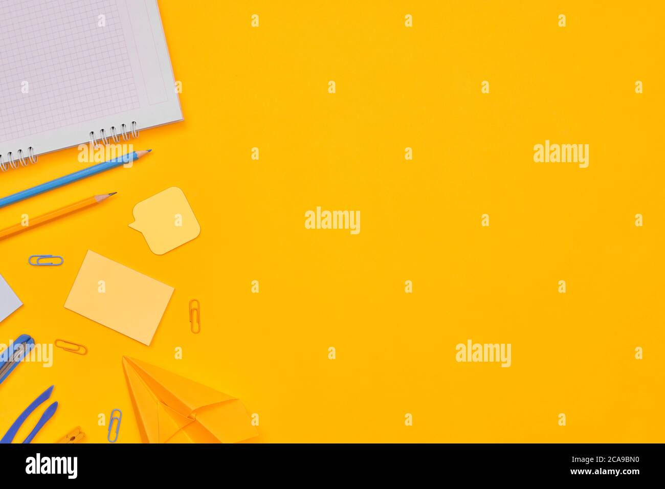 minimalism yellow-blue stationery on yellow background school ...