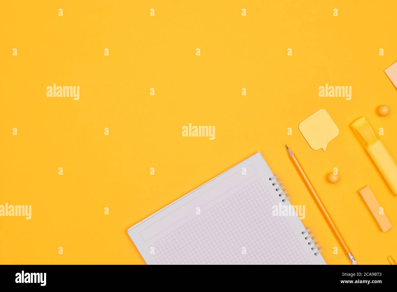 minimalism yellow stationery on a yellow background school, university ...