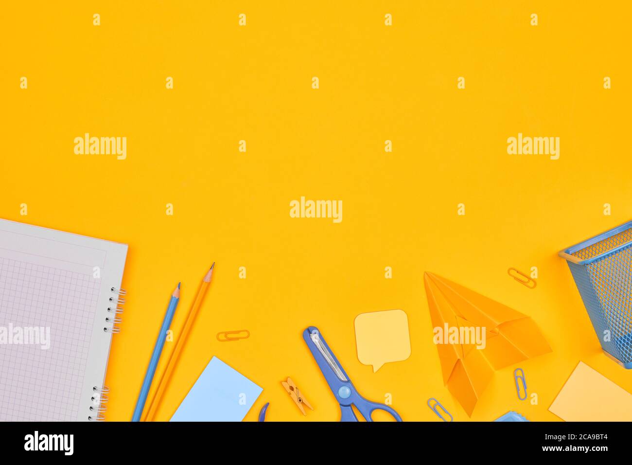 minimalism yellow-blue stationery on yellow background school ...