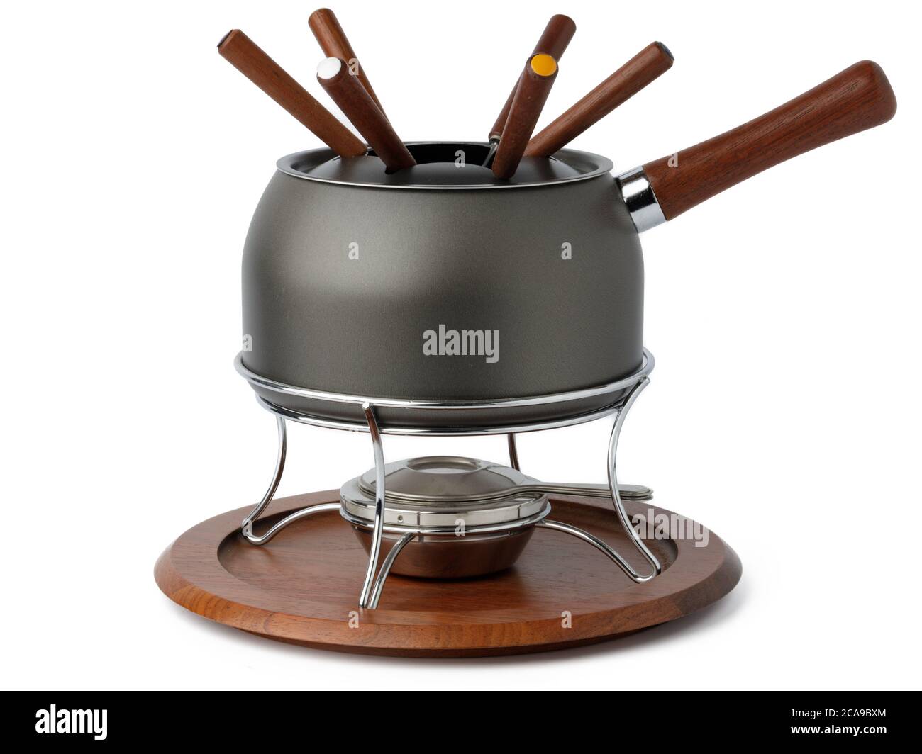 Metal cookware for fondue preparation on white Stock Photo - Alamy