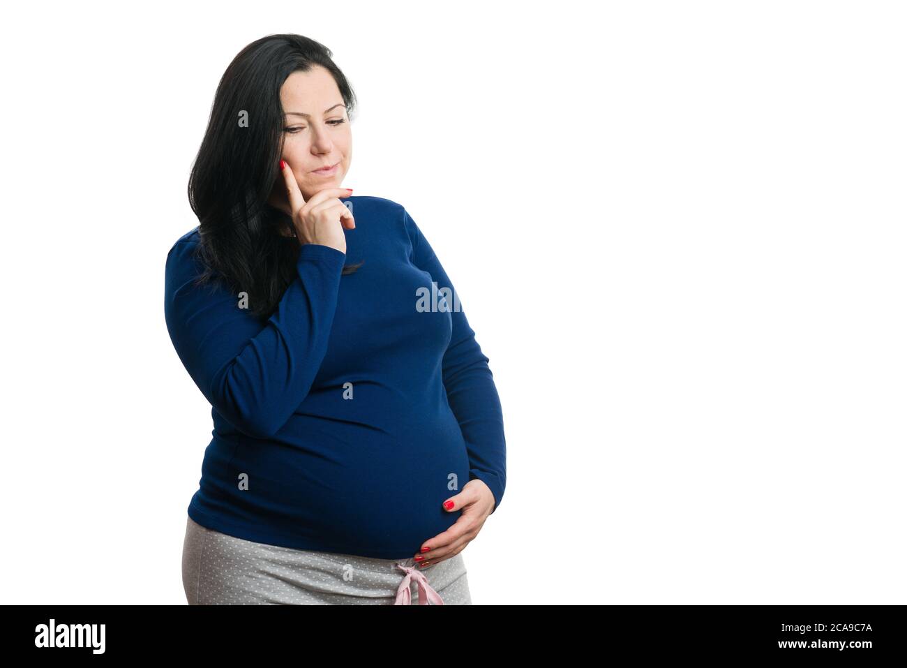 Future mother making thinking gesture isolated on white background as ...