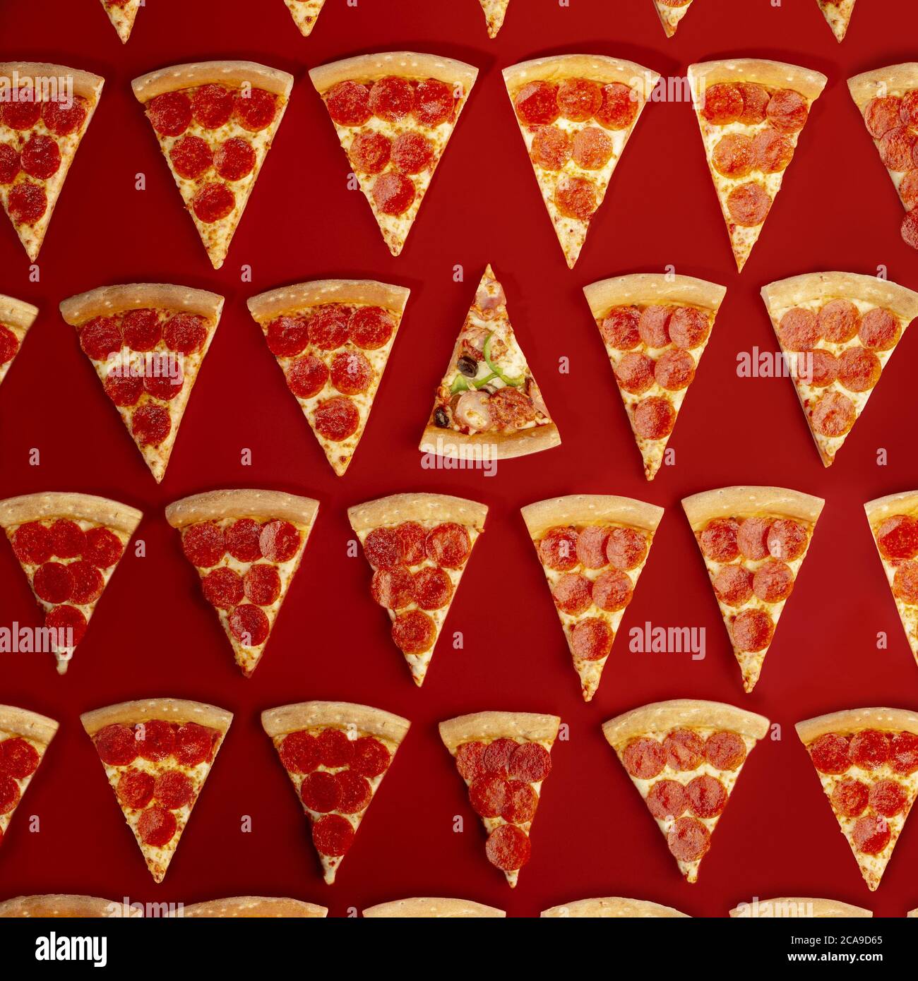 Top view shot of Pepperoni pizza slices and overturned slice of pizza ...