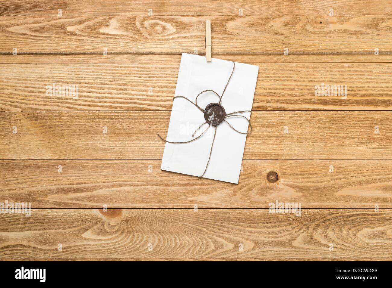 Mail envelope on rope Stock Photo - Alamy