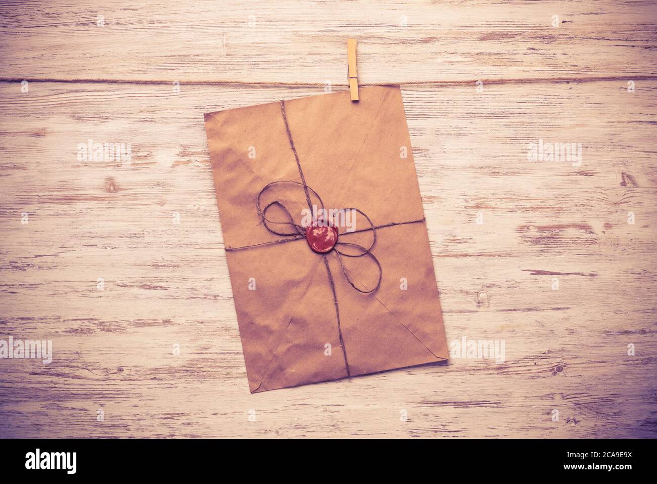 Mail envelope on rope Stock Photo - Alamy