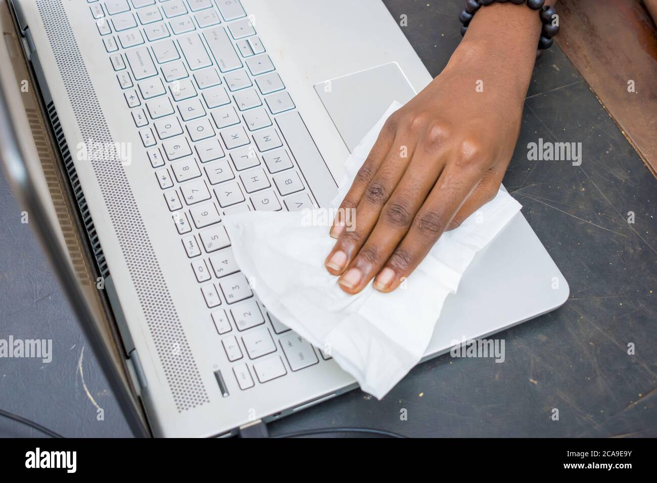 Woman hands wiping laptop keyboard hi-res stock photography and images ...