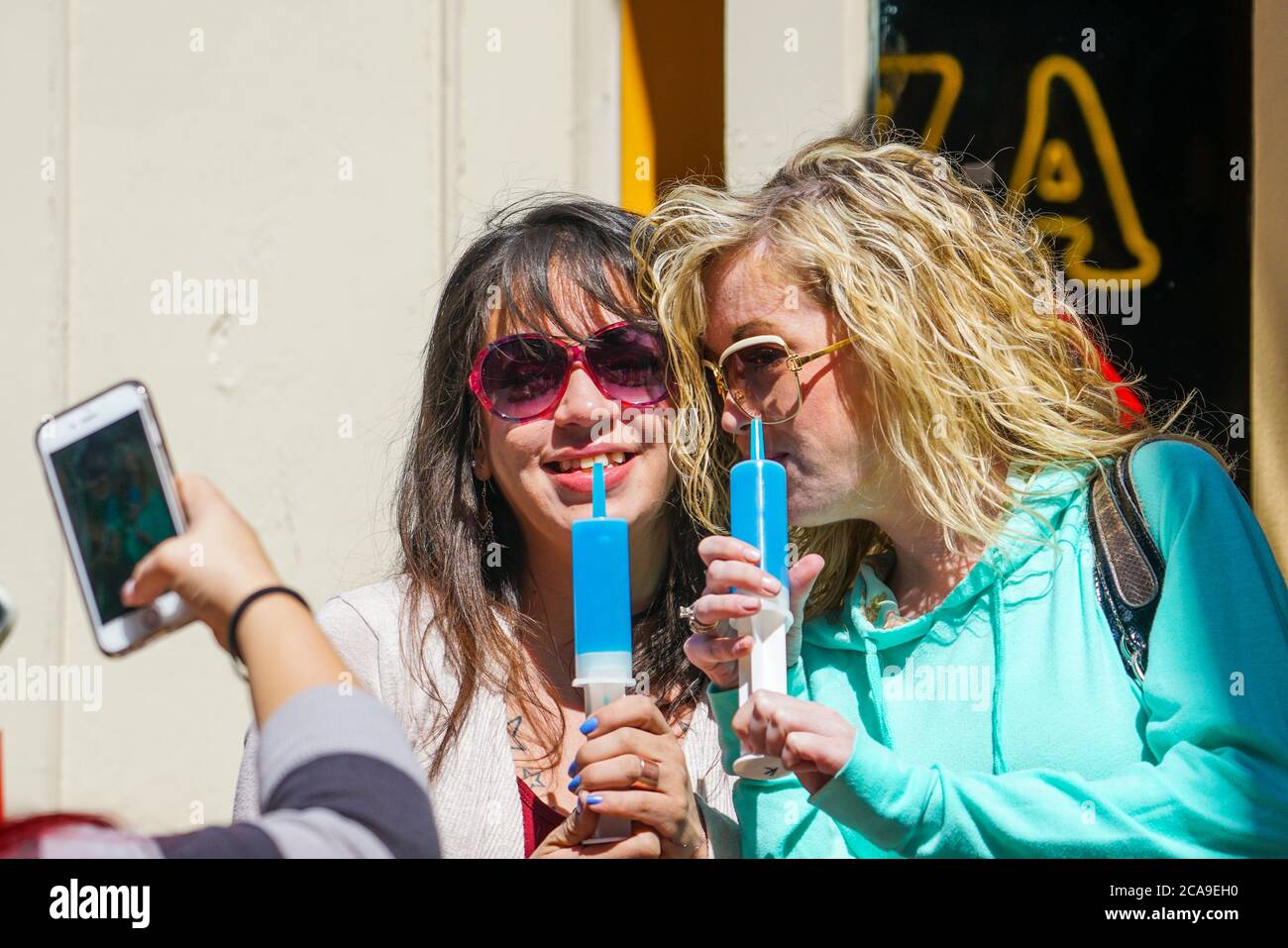 New Orleans - 04/15/2018 : girls enjoying a jello syringe shot, a ...