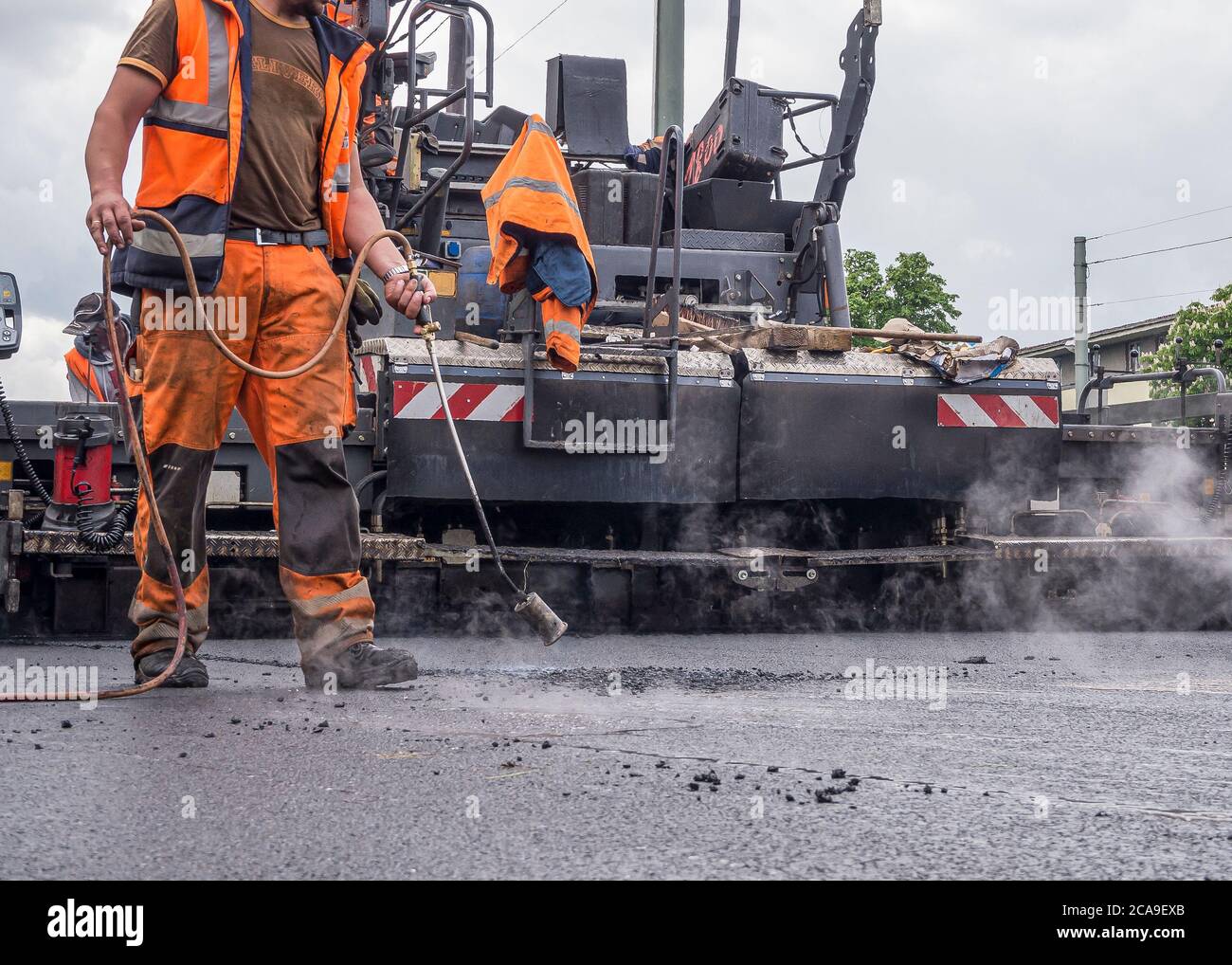 Roadworks, application of new asphalt on german highway Stock Photo - Alamy