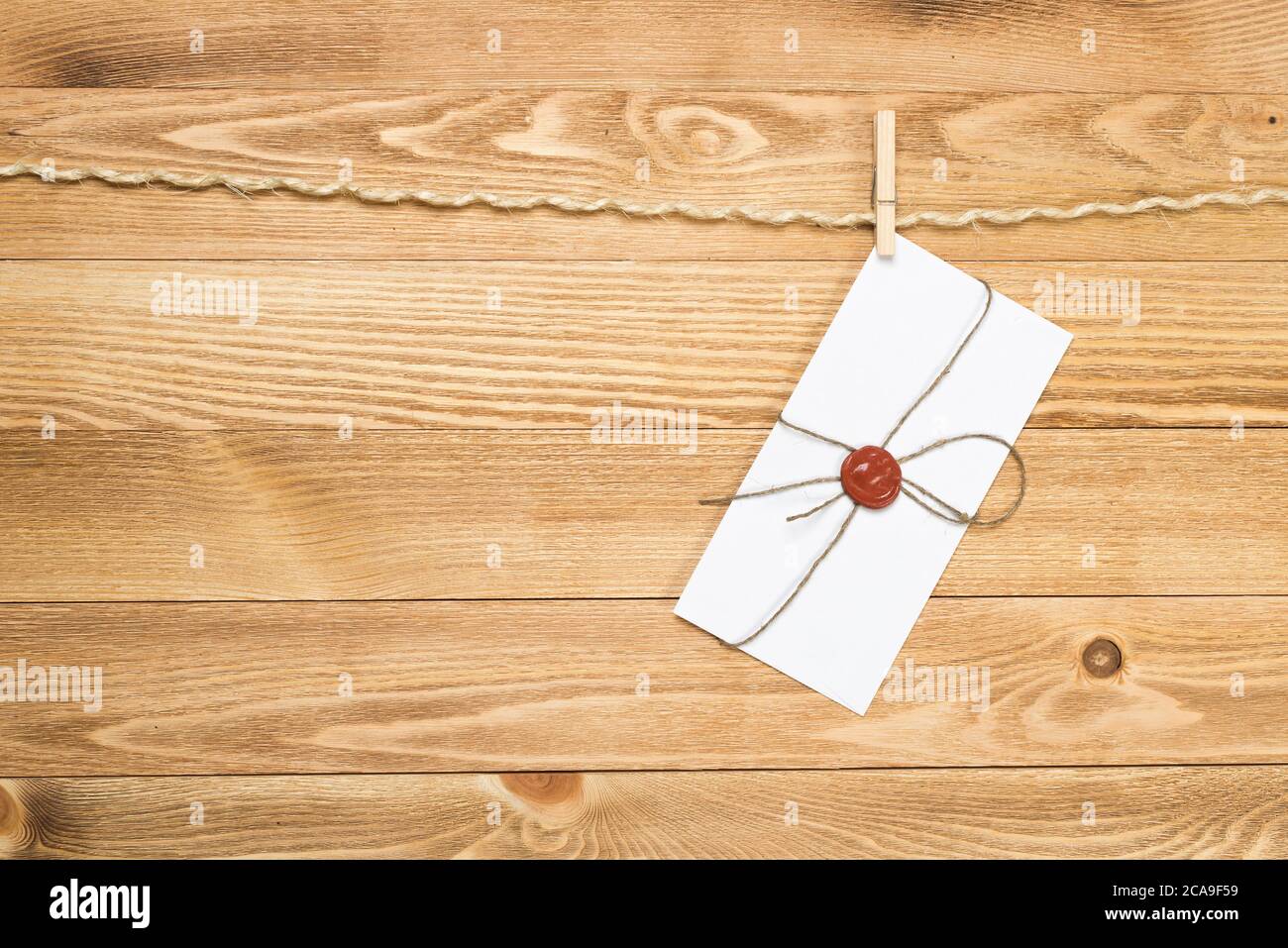 Mail envelope on rope Stock Photo - Alamy