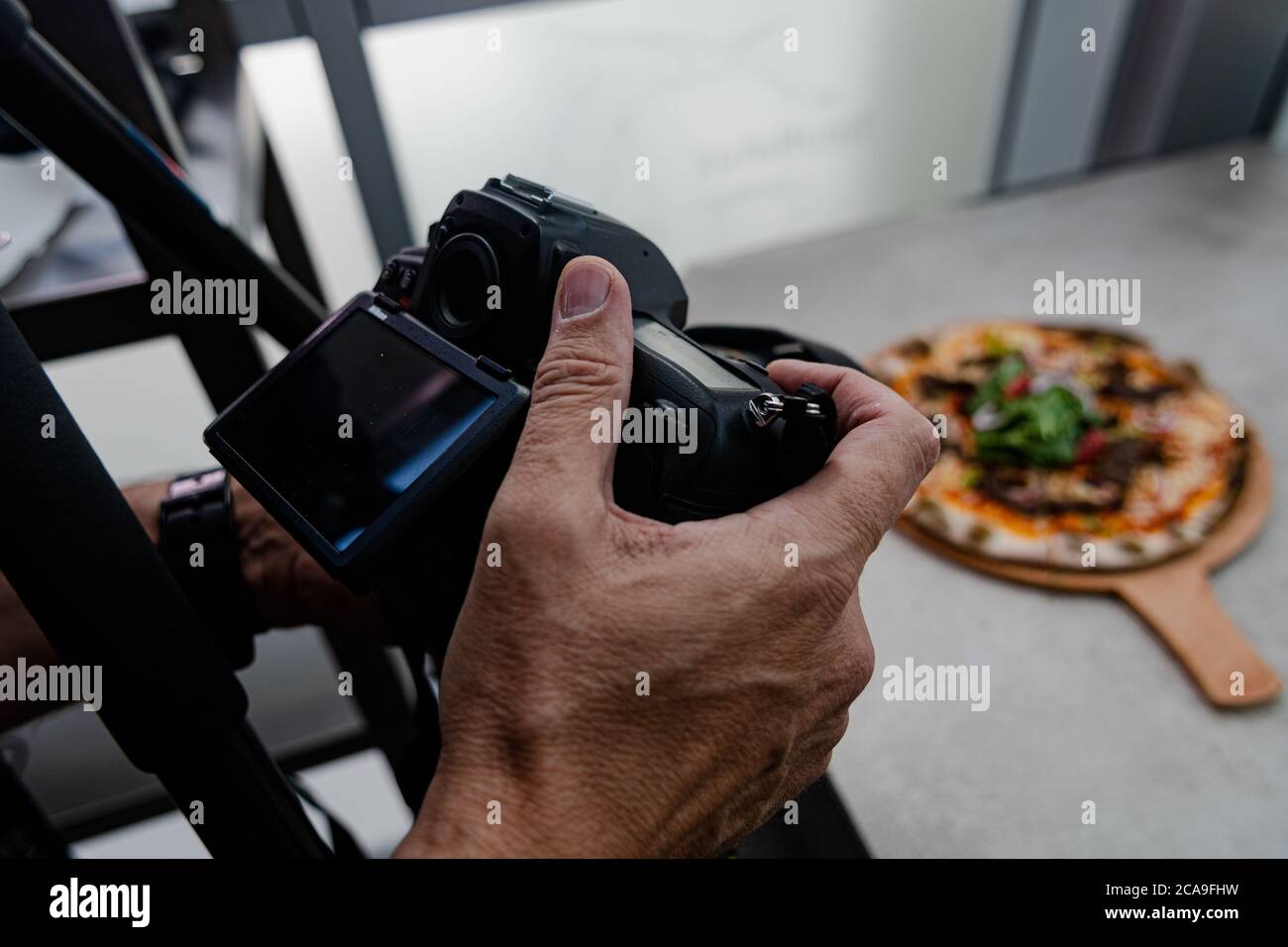 Food photographer is shooting pizza Stock Photo - Alamy