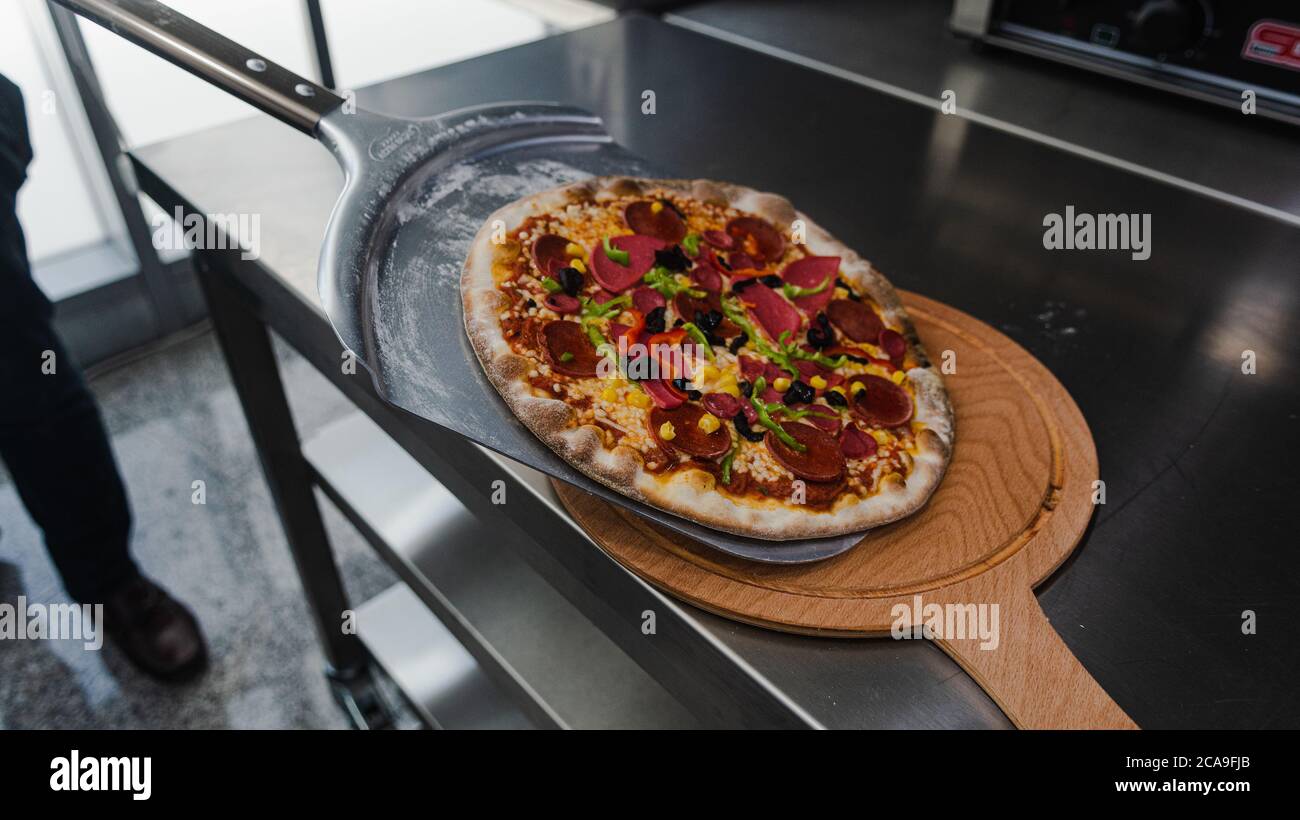 Phases of preparation of pizza making Stock Photo - Alamy