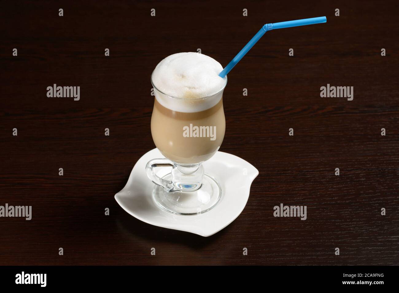 Coffee with a tube in a glass Cup on a wooden table. Photos for ...