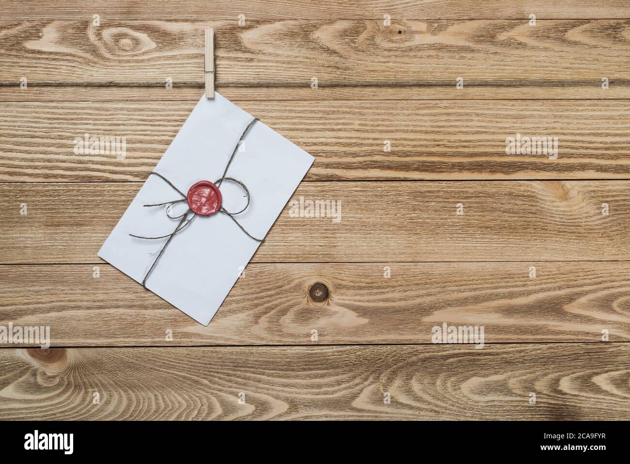 Mail envelope on rope Stock Photo - Alamy