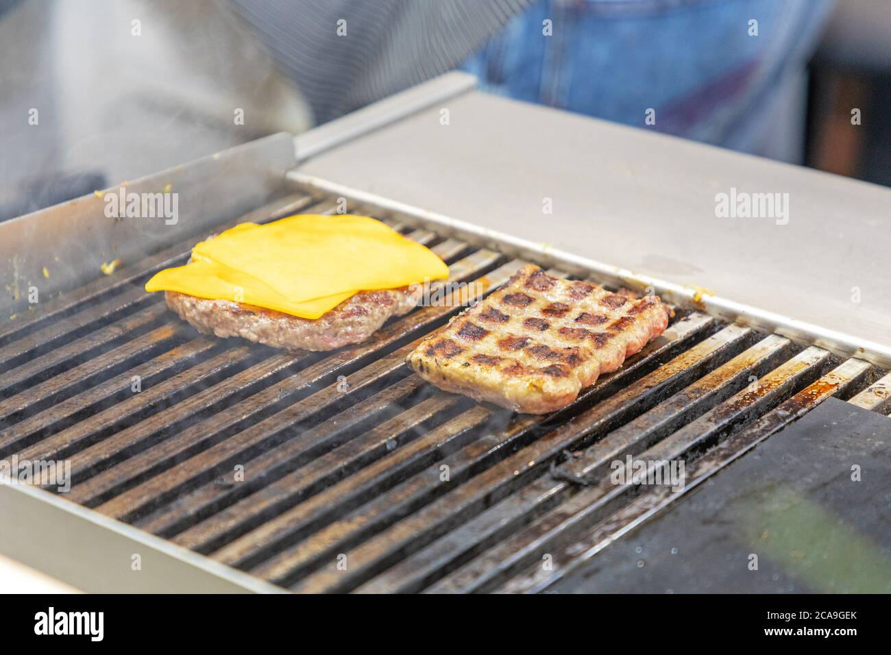 Putting Cheese at Minced Meat Patty Grill Stock Photo - Alamy