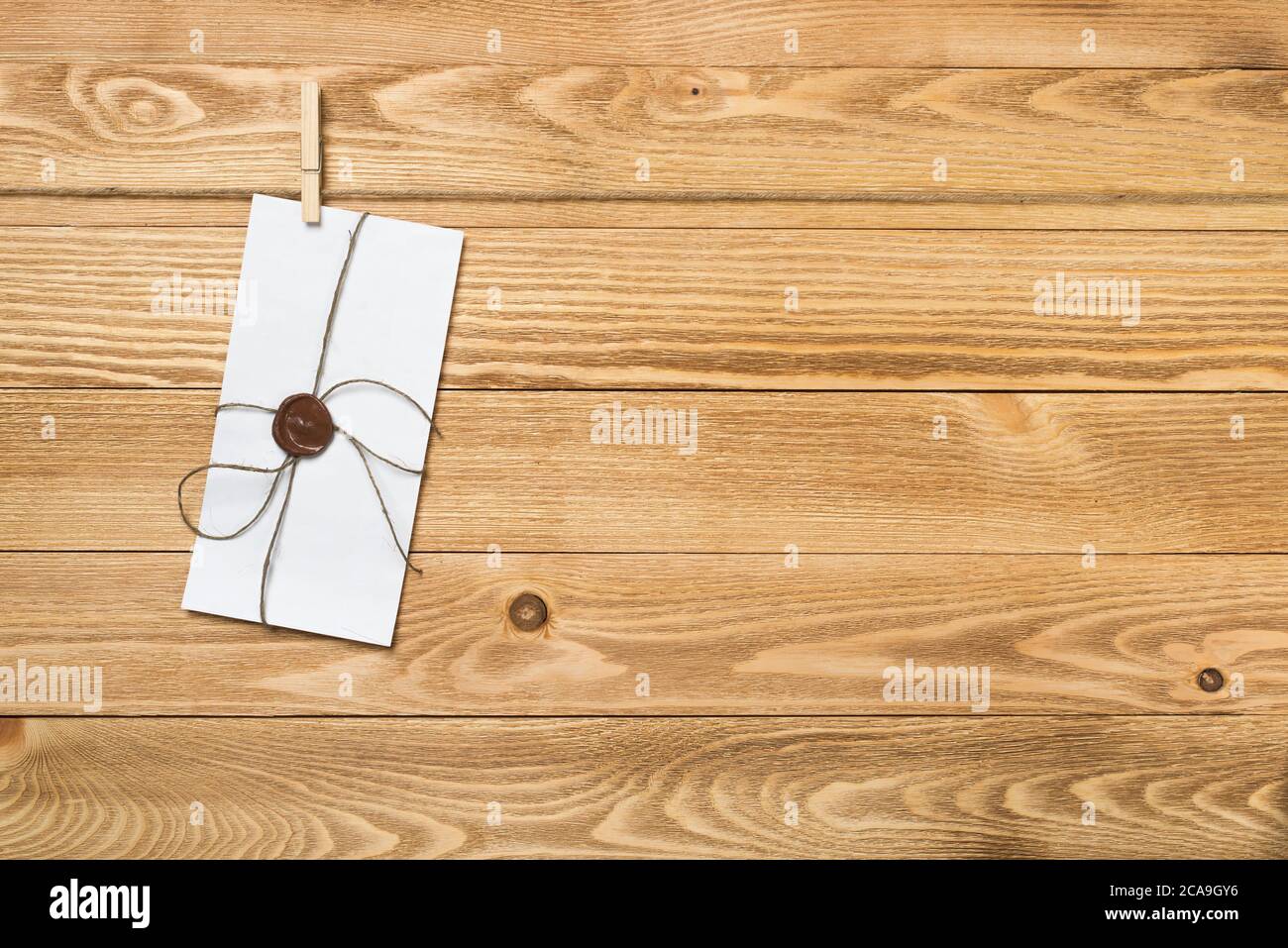 Mail envelope on rope Stock Photo - Alamy