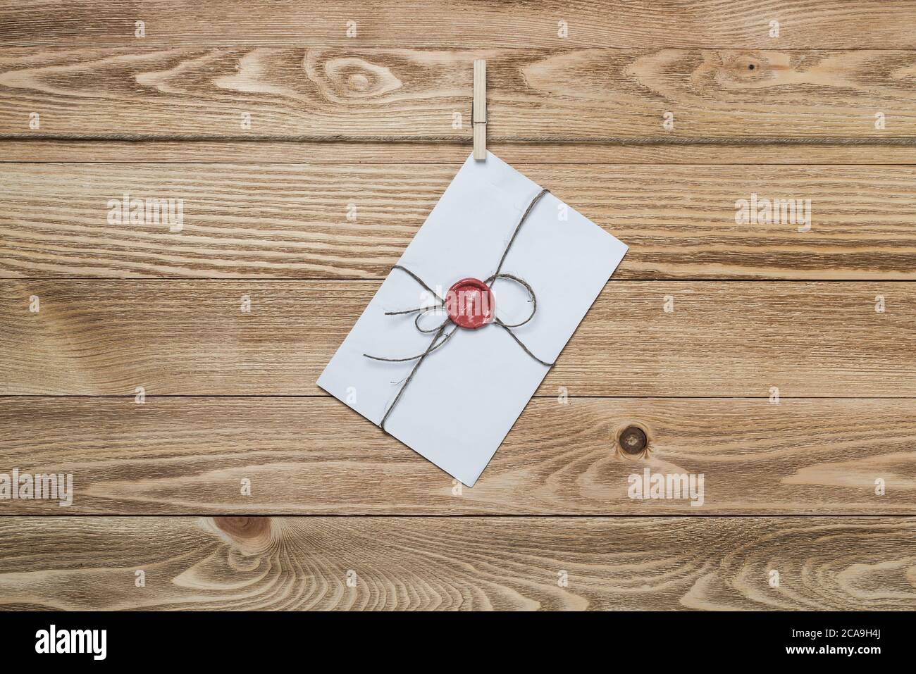 Mail envelope on rope Stock Photo - Alamy