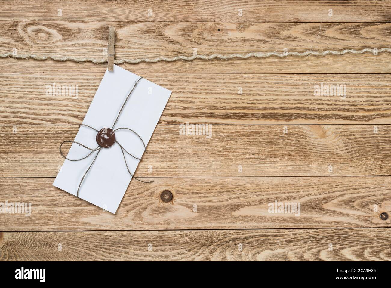 Mail envelope on rope Stock Photo - Alamy