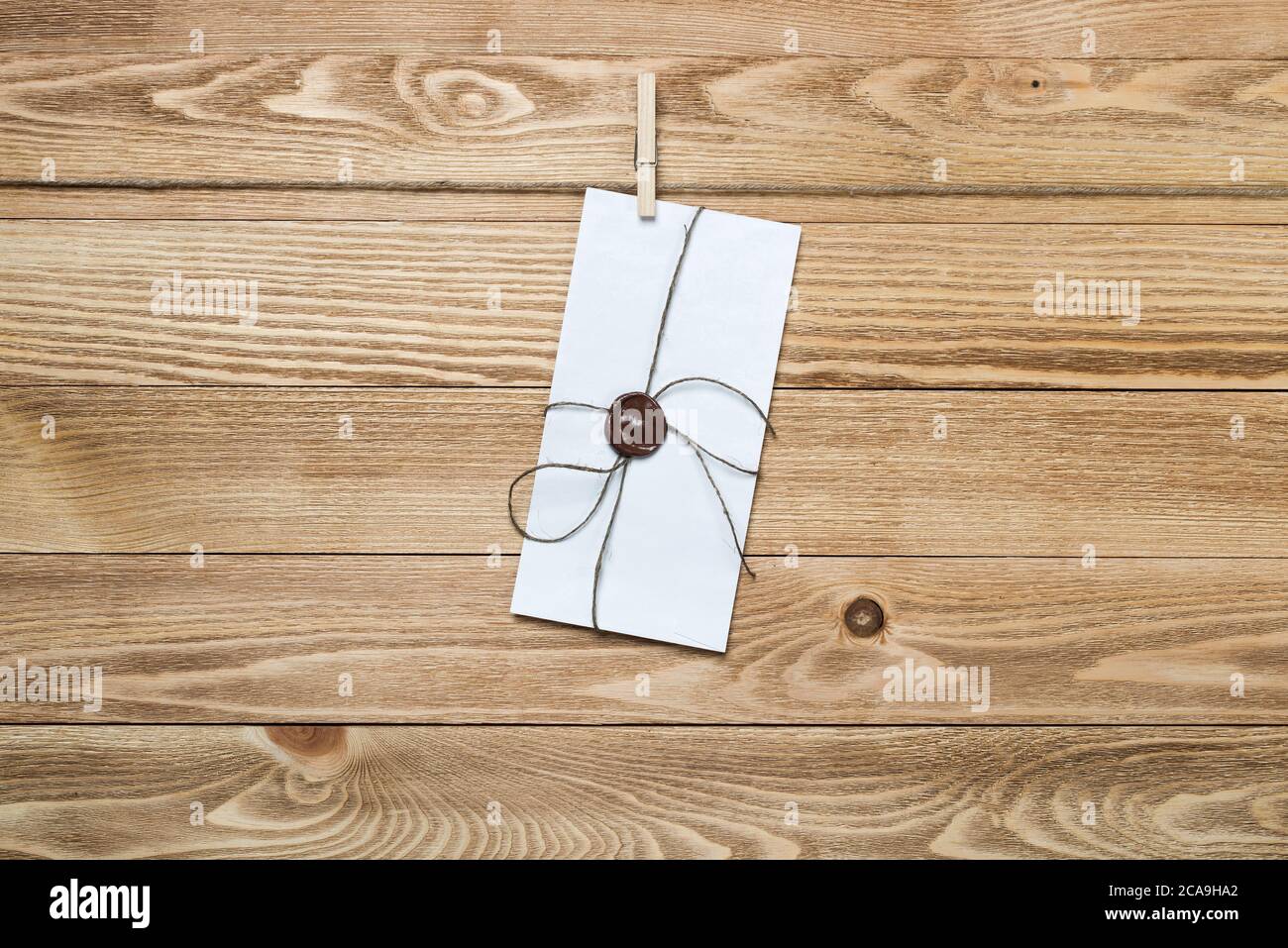 Mail envelope on rope Stock Photo - Alamy