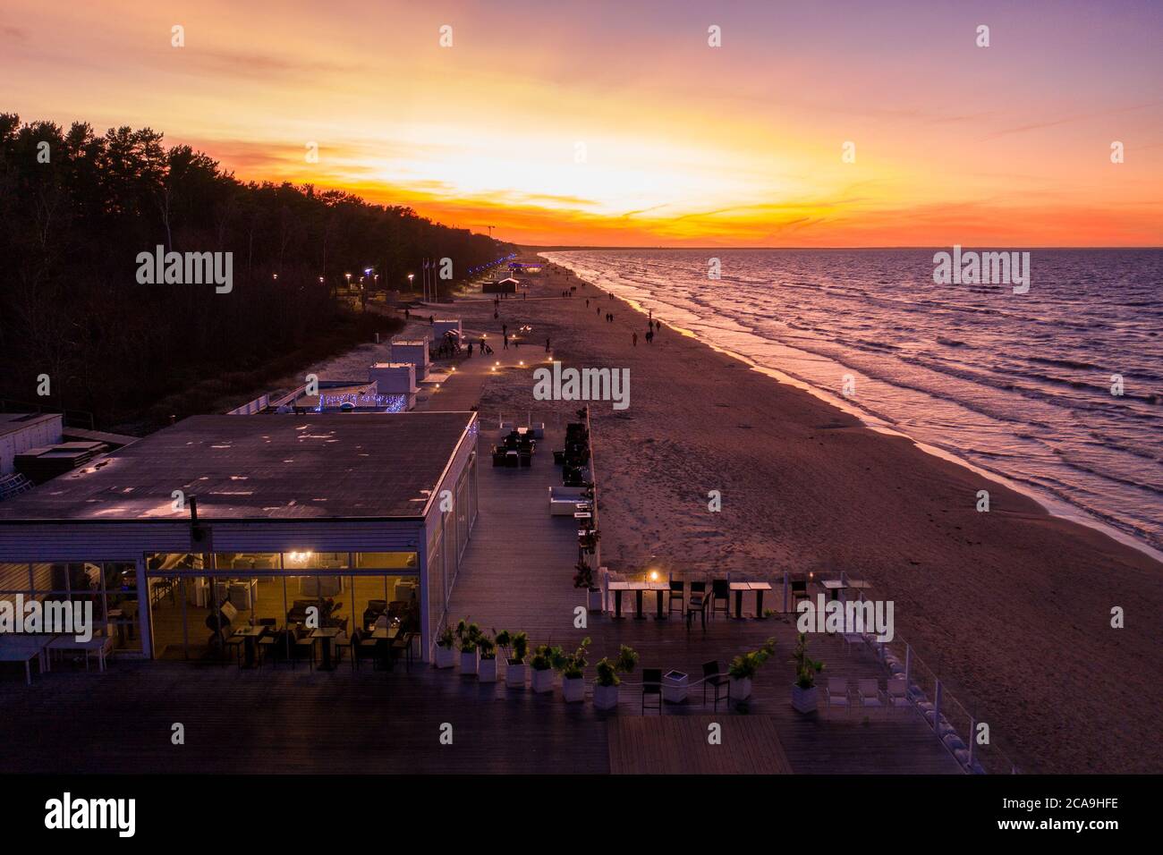 Aerial shot of a beautiful sunset over a beach resort by the Baltic Sea ...