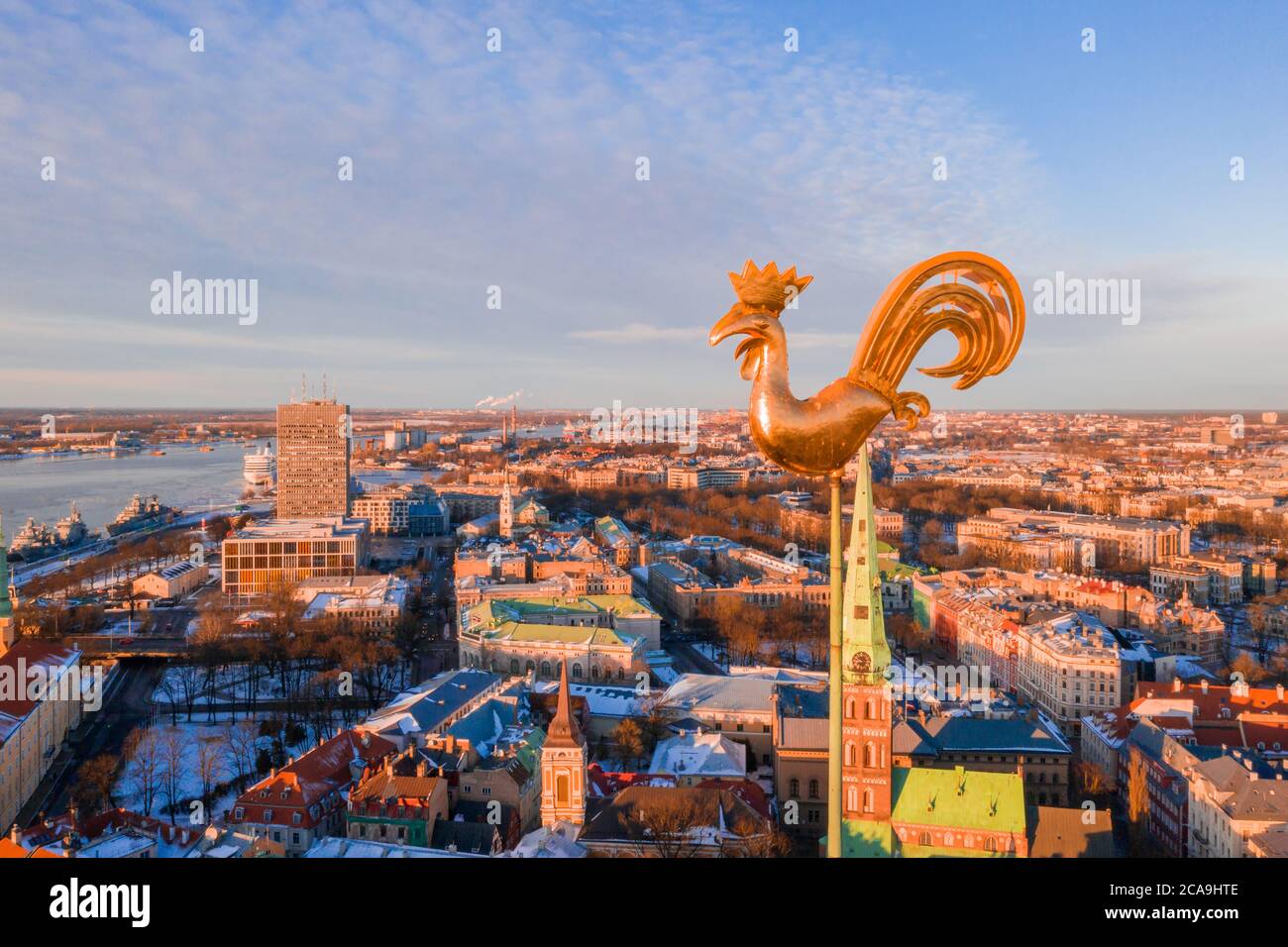Golden rooster on a spire overlooking the old town of Riga in Latvia ...