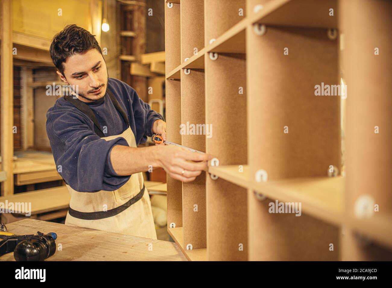 custom-made furniture concept. handicraft carpentry. young caucasian ...