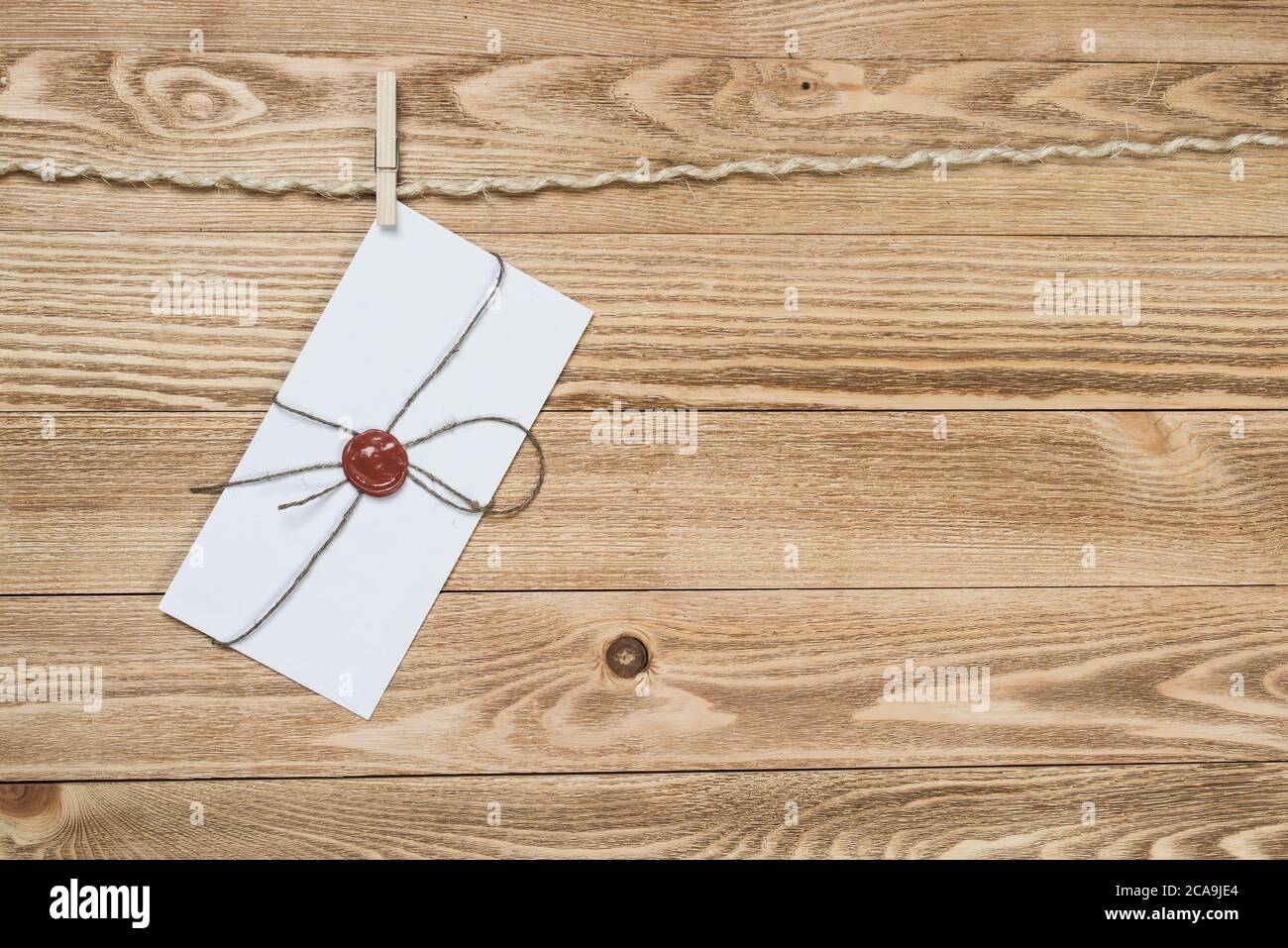 Mail envelope on rope Stock Photo - Alamy