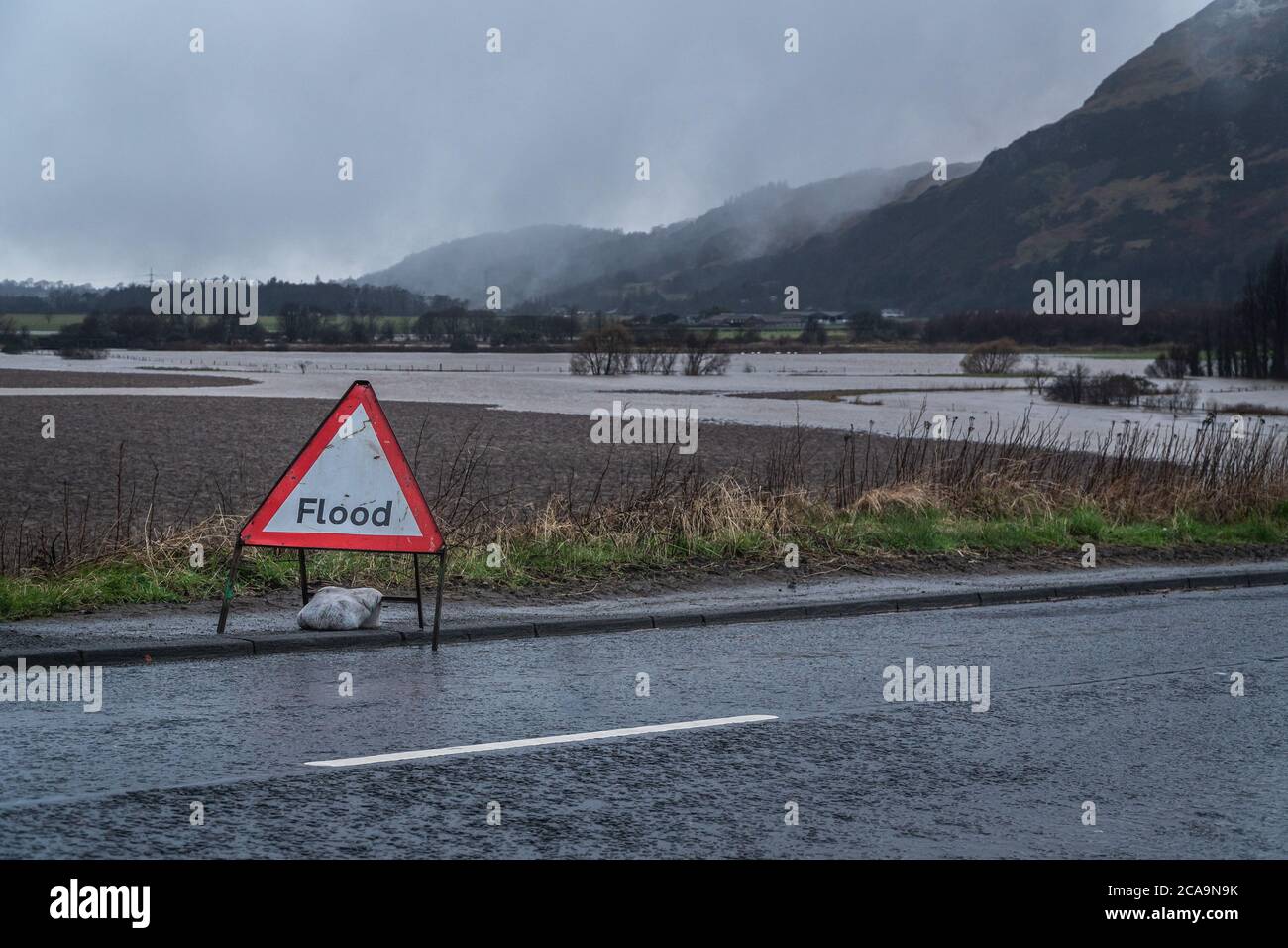 Roads flooded and flood warning signs in place Stock Photo - Alamy