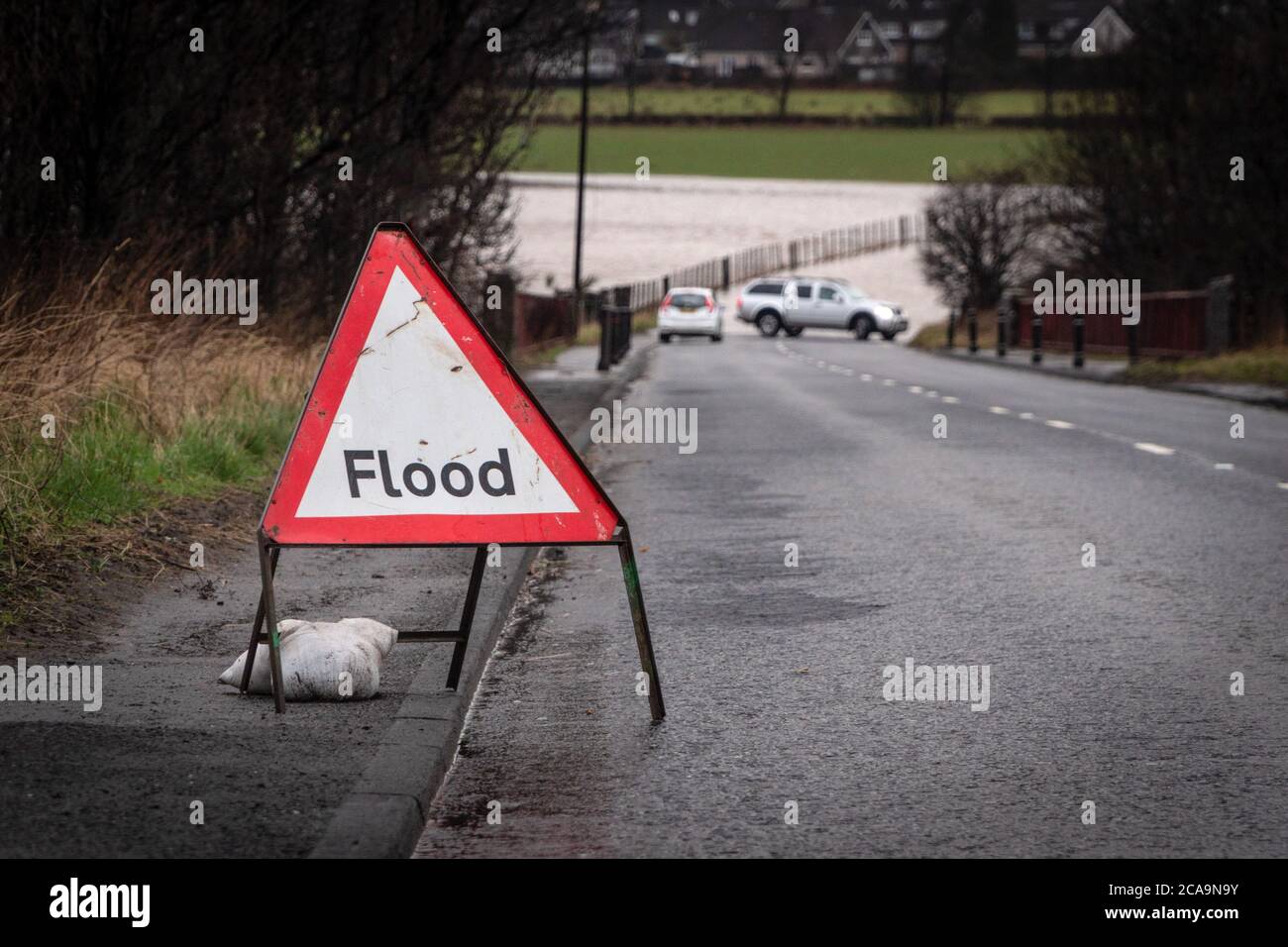 Roads flooded and flood warning signs in place Stock Photo - Alamy