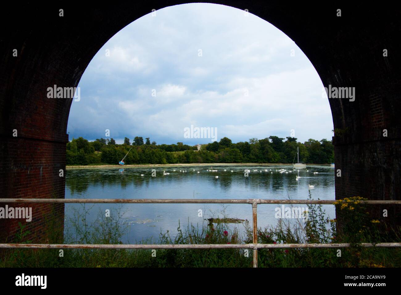 View framed through the arch of a railway bridge Stock Photo - Alamy