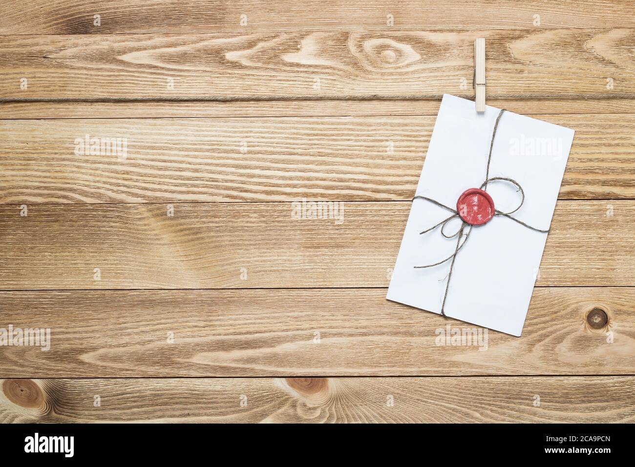 Mail envelope on rope Stock Photo - Alamy