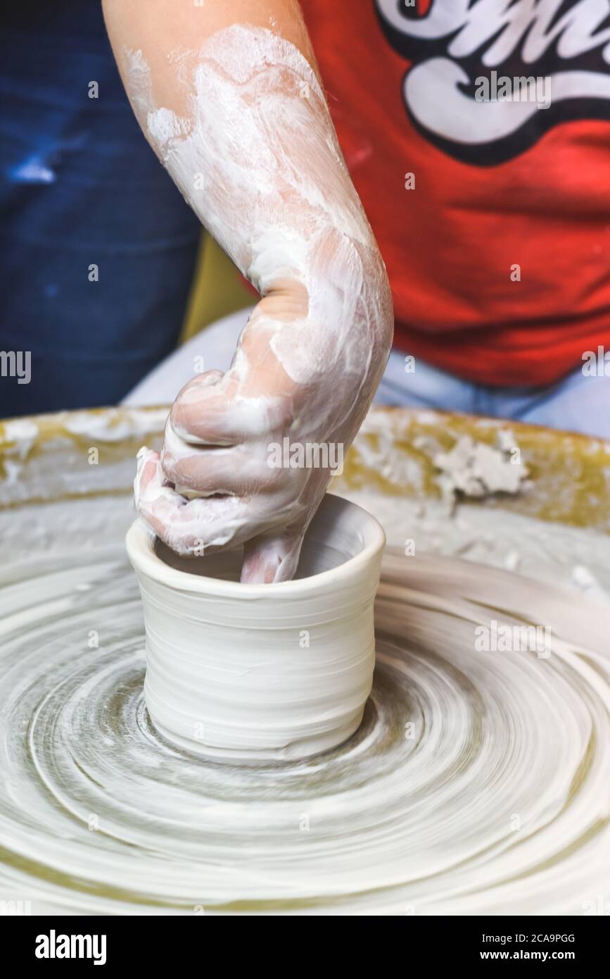Children making pottery during ceramic lesson with clay Stock Photo - Alamy