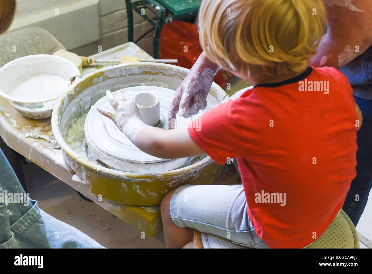 Children making pottery during ceramic lesson with clay Stock Photo - Alamy